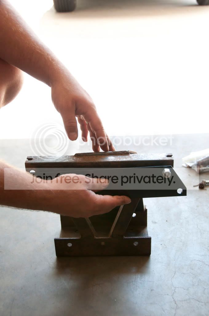Where does the shock mount plate go?